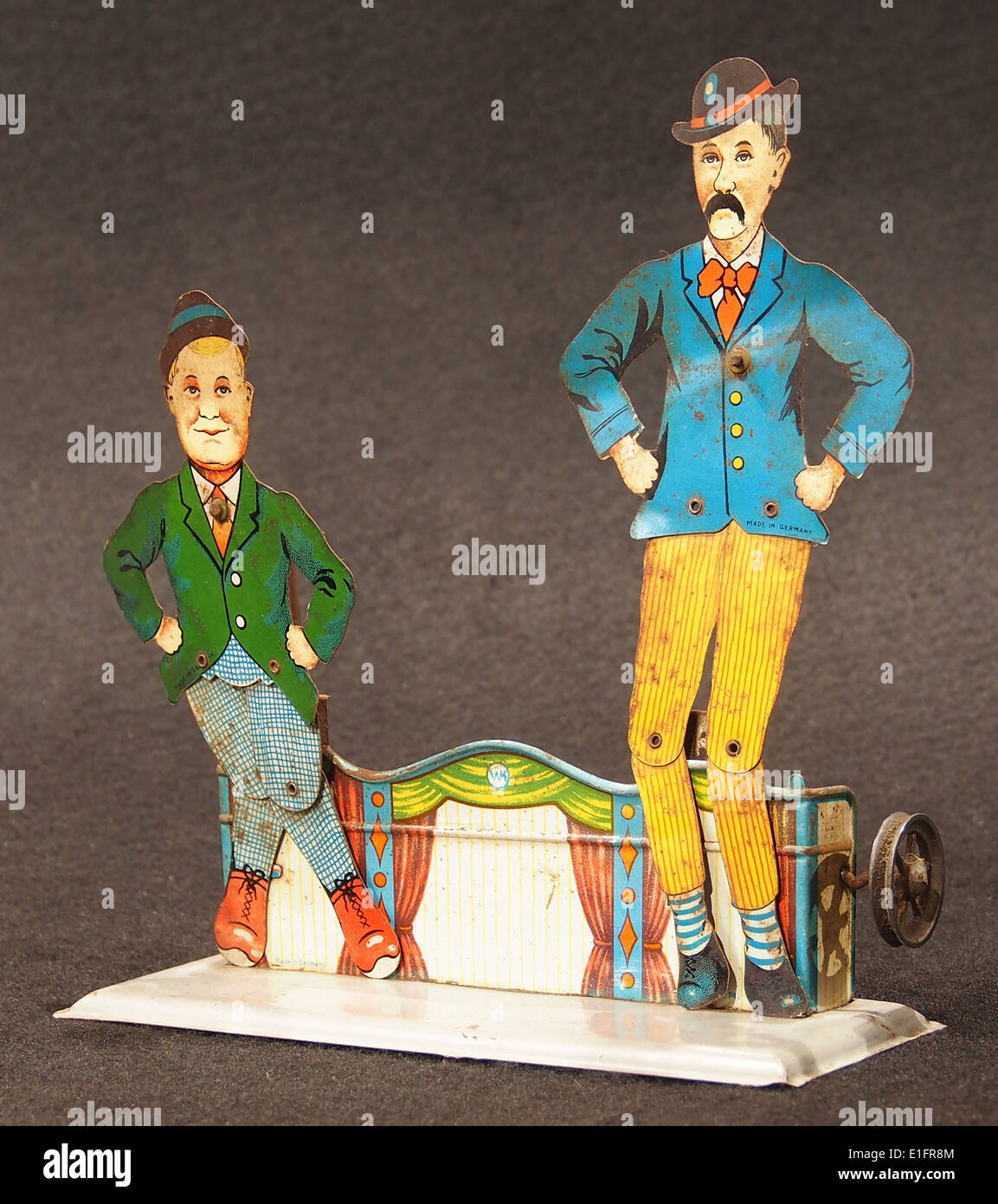 Two movable tin toy figures, showcasing mechanical movement, common in ...