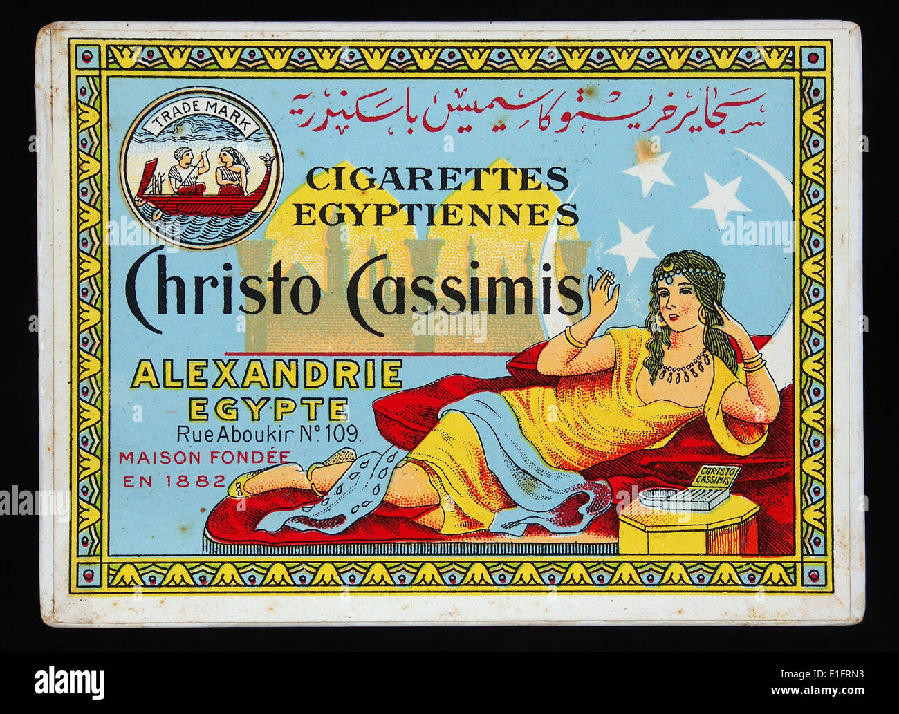 A blue cigarette box designed by Christo Cassimis features an image of ...