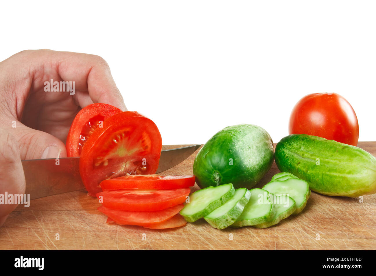 chop tomatoes and cucumbers isolated on white background Stock Photo ...
