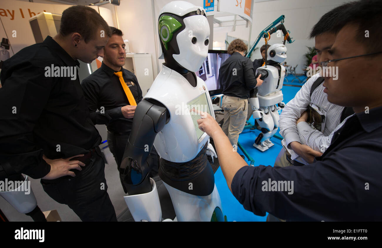 Munich, Germany. 03rd June, 2014. People look at the REEM robot by ...