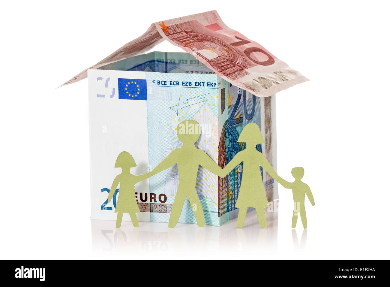Family and their Euro house made from banknotes on white background ...