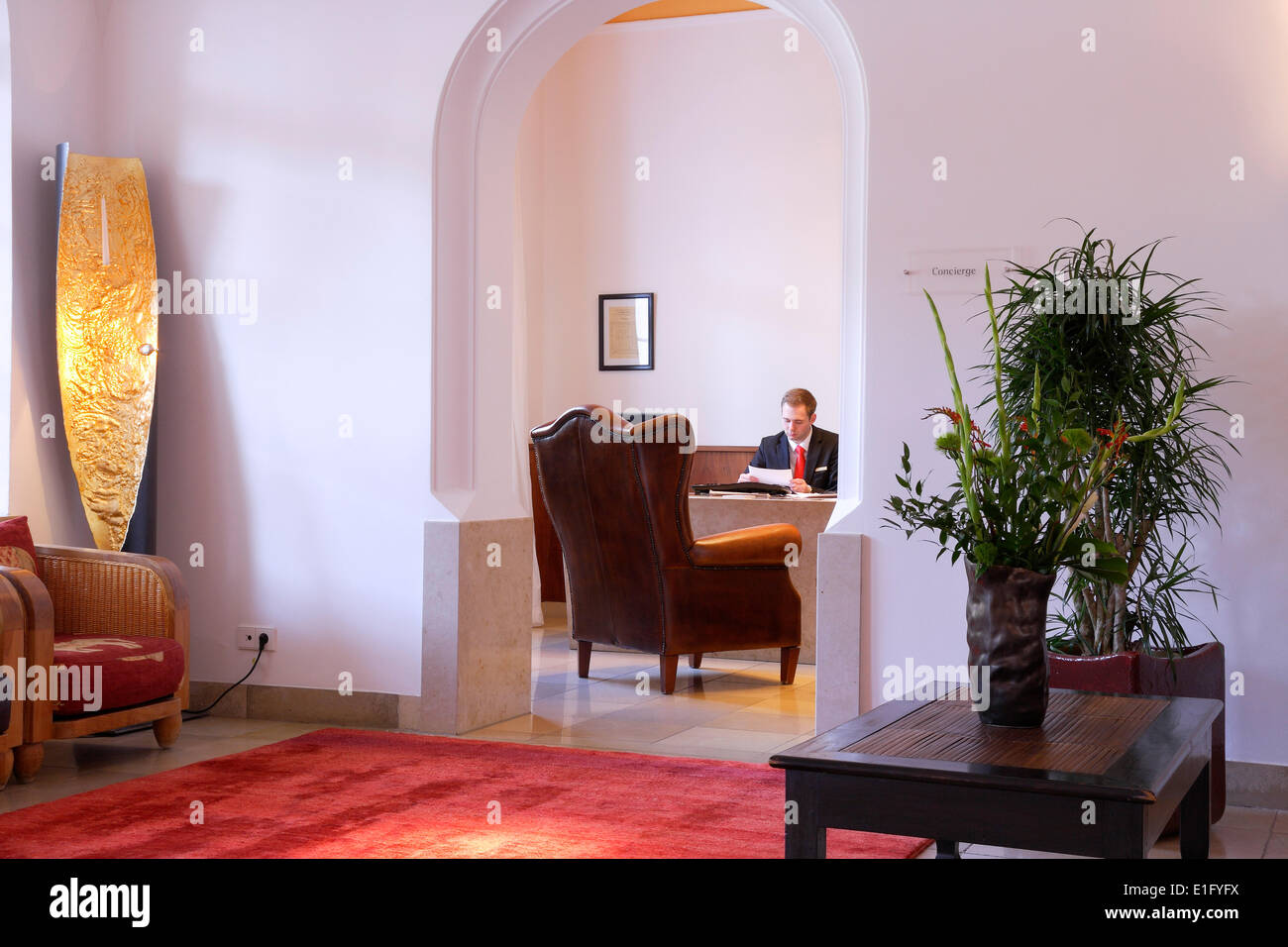The interior of the foyer in Elmau castle near Kruen with the office of ...