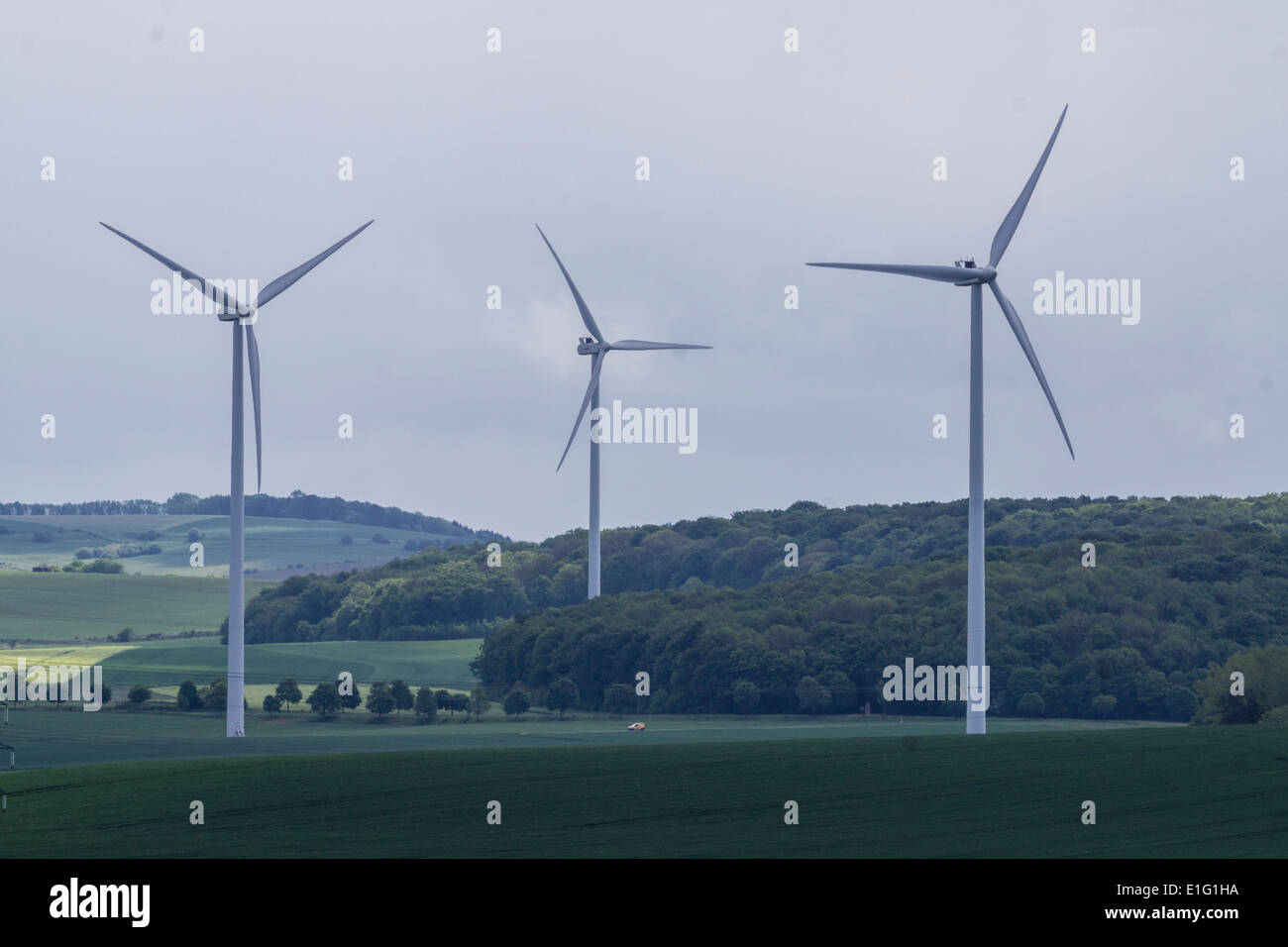 France. Wind turbines tower over building and farms Stock Photo - Alamy