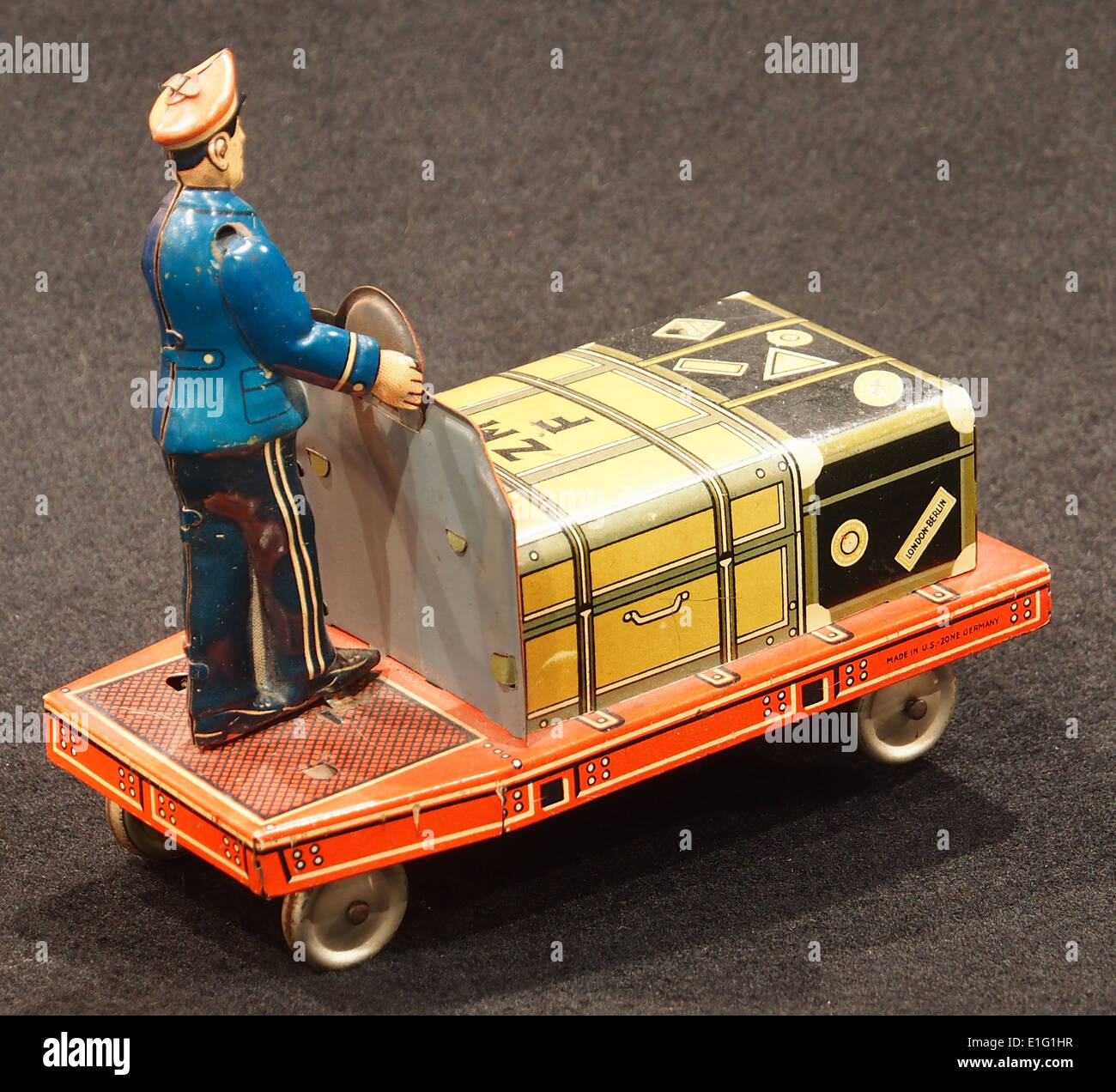 This vintage tin toy suitcase trolley is a collectible item, showcasing ...