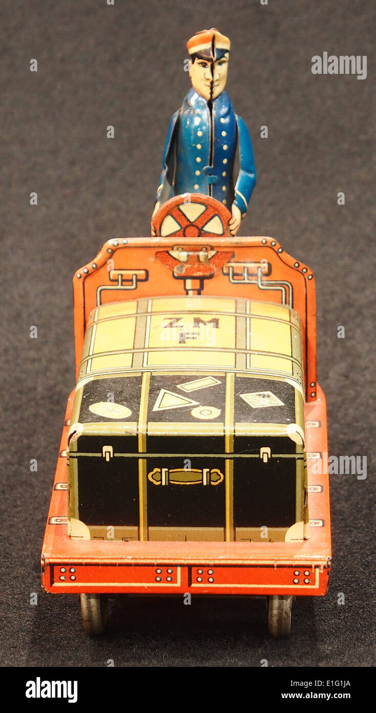 A tin toy suitcase trolley is a collectible item, often featured in ...