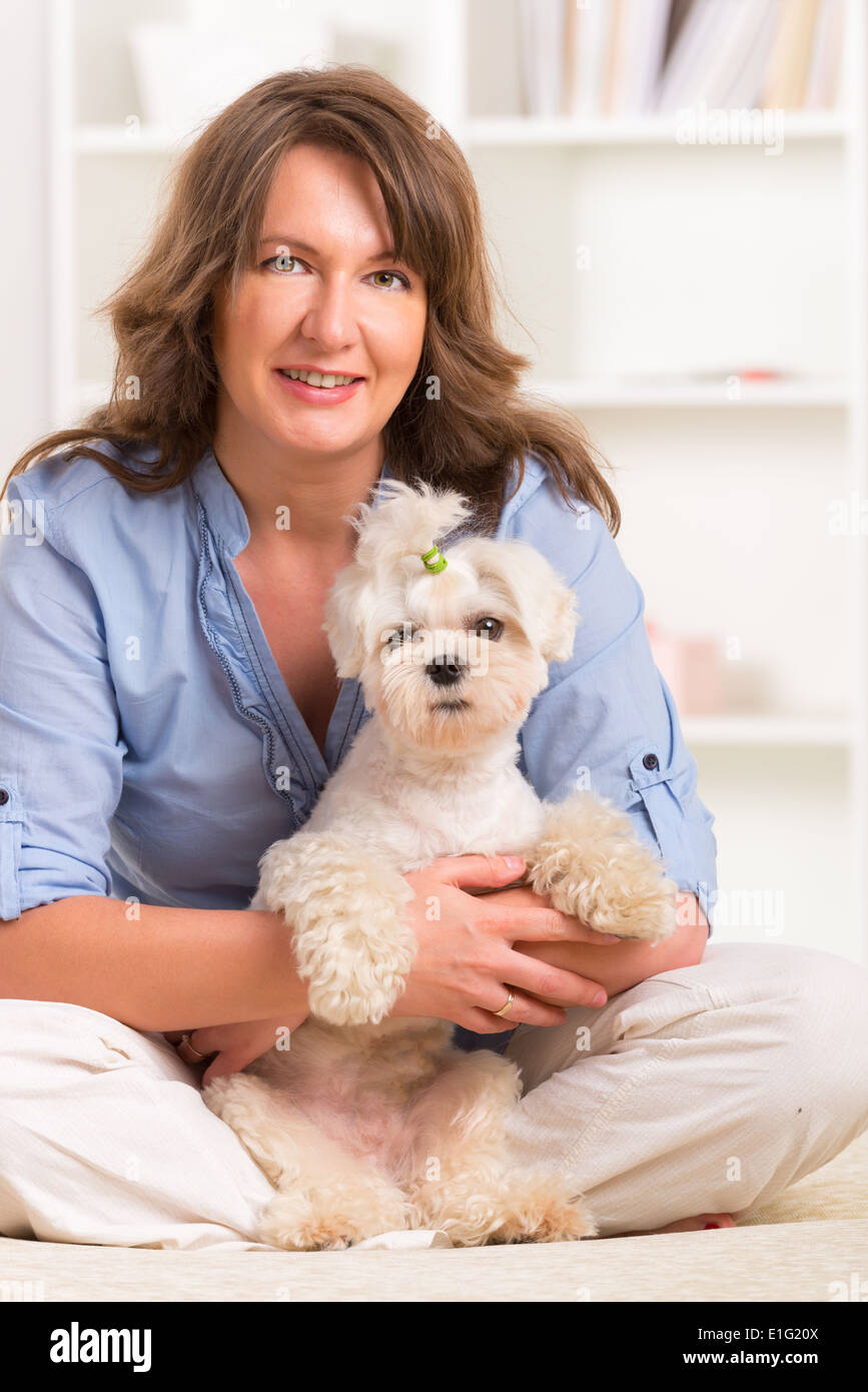 Woman holding maltese dog hi-res stock photography and images - Alamy