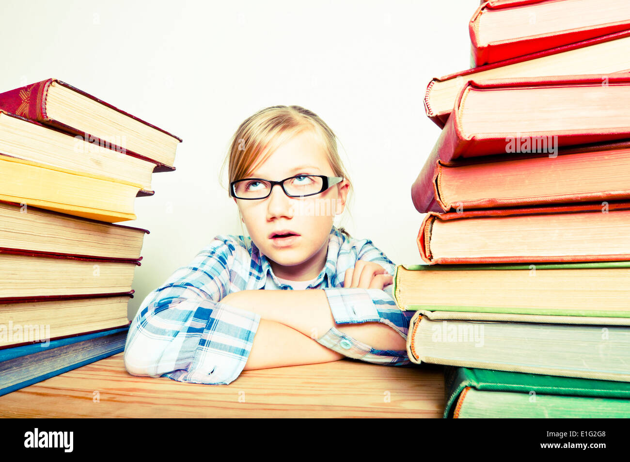 Bored child studying Stock Photo - Alamy