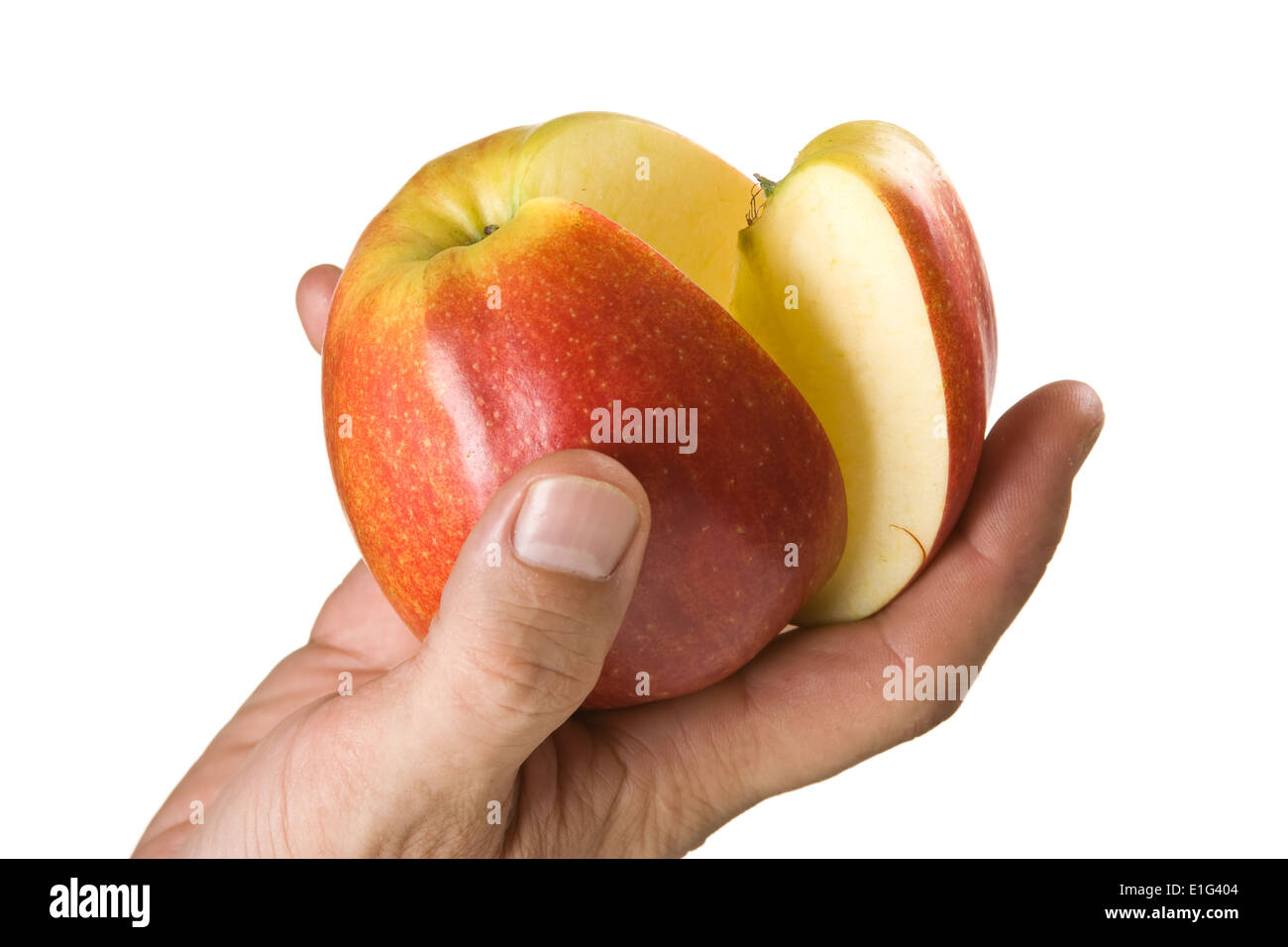 slices apple in the hand isolated on white background Stock Photo - Alamy