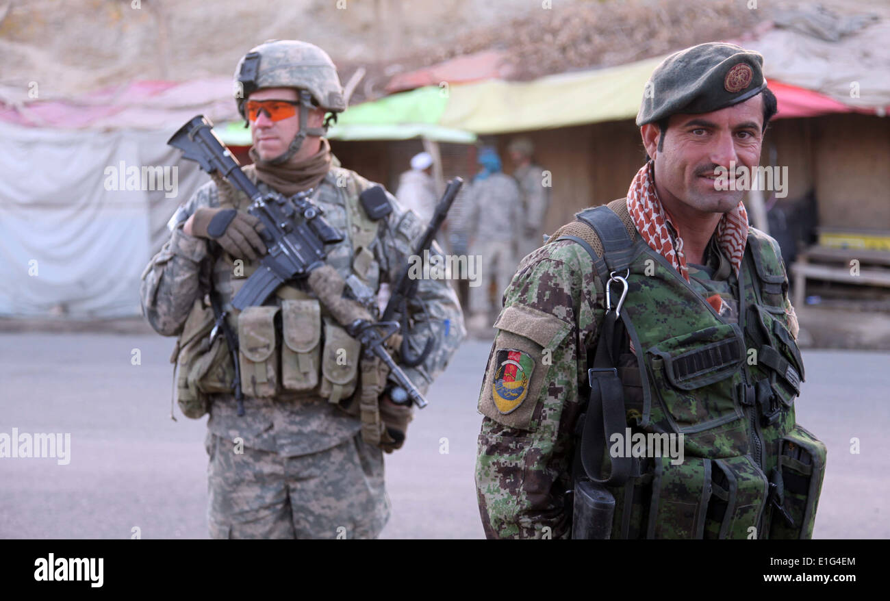 U.S Army Staff Sgt. Andrew Beauchamp, left, and an Afghan National Army ...