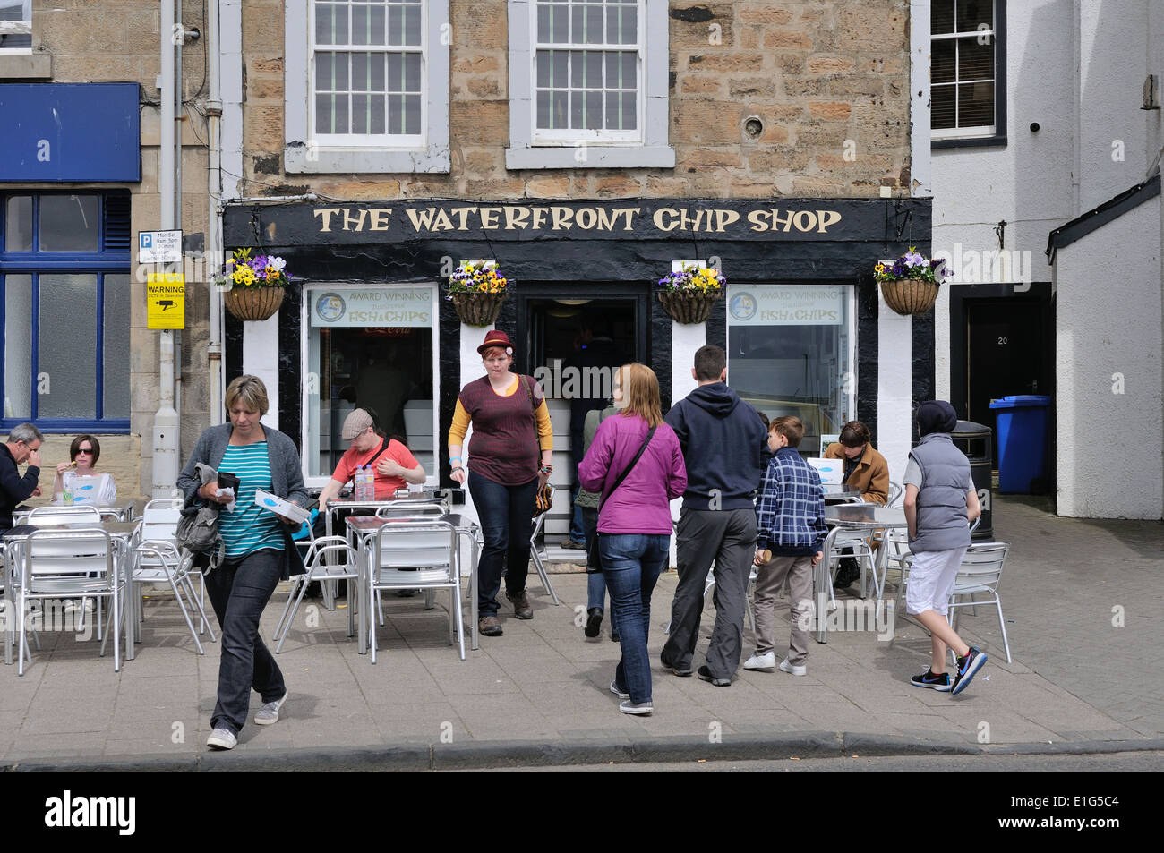 Pavement seating chippy scotland fish and chips harbour hi-res stock ...