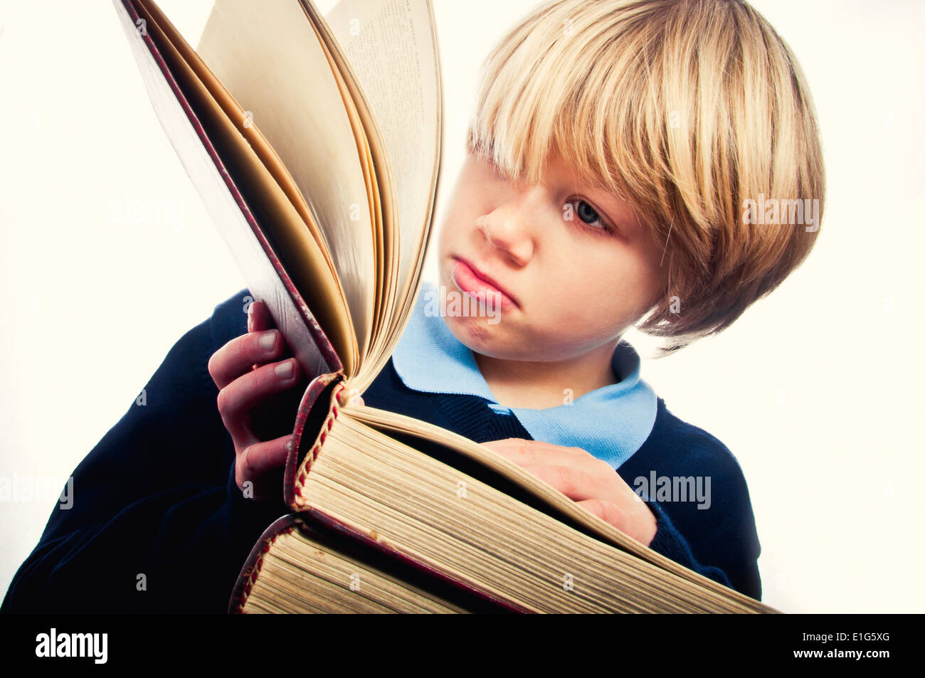 Boy learning to read isolated against white Stock Photo - Alamy