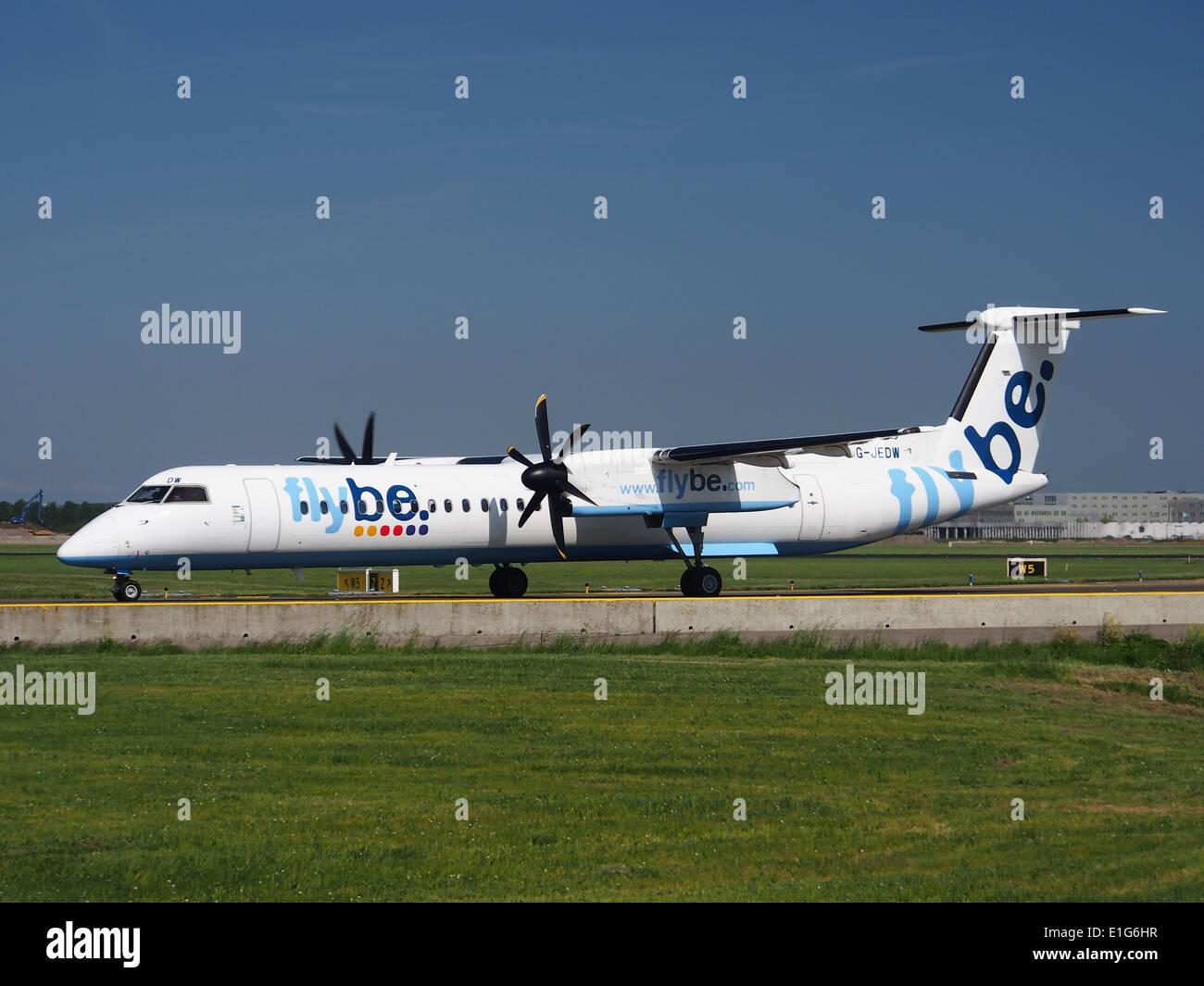G-JEDW is a Flybe Dash 8 turboprop aircraft seen at Schiphol Airport on ...