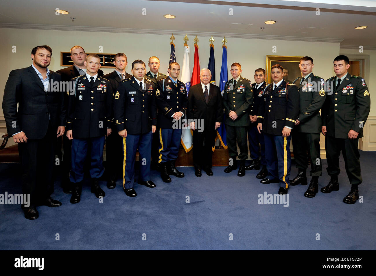 U.S. Secretary of Defense Robert M. Gates, center, stands for a photo ...