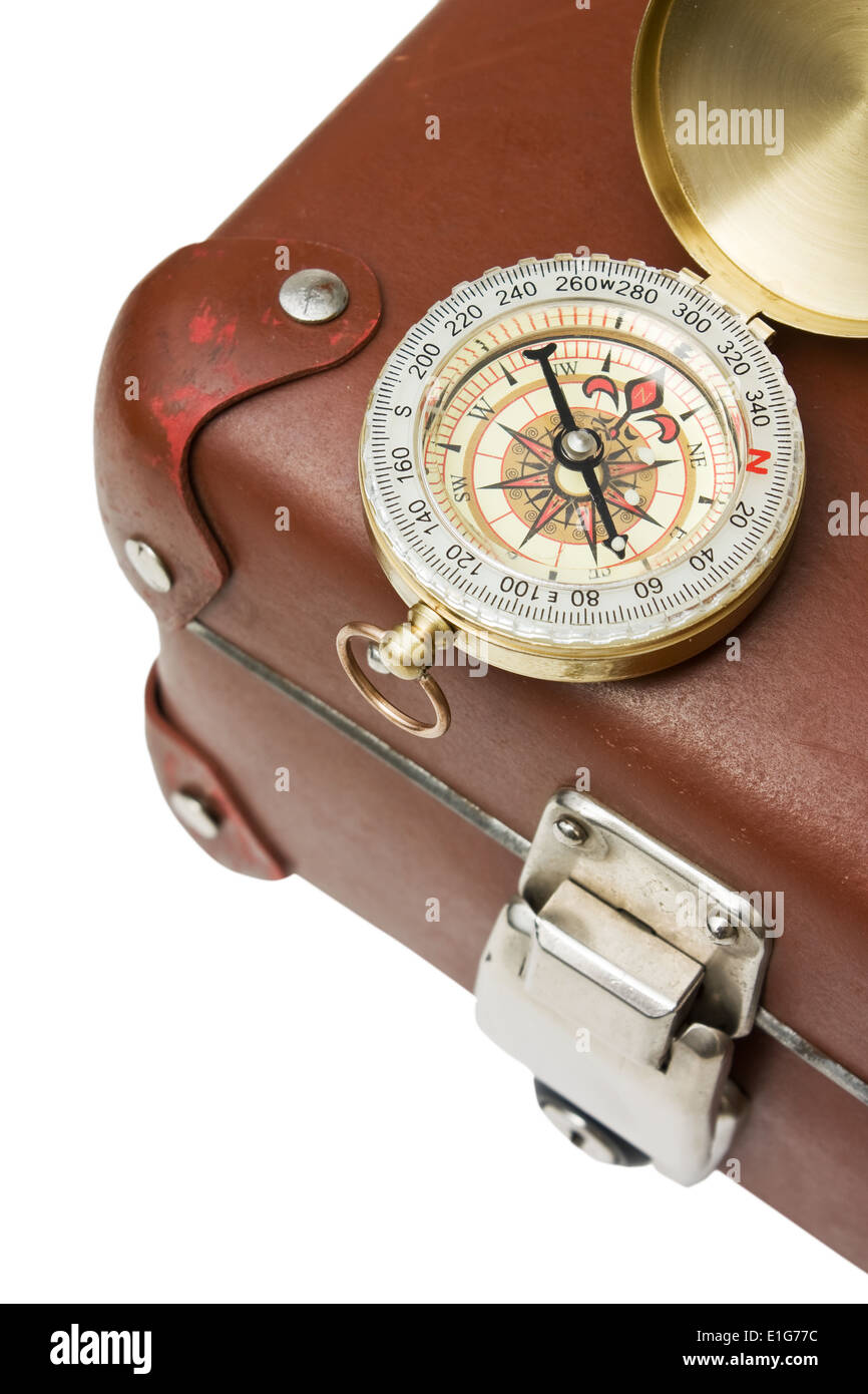 old suitcase and compass isolated on white background Stock Photo - Alamy