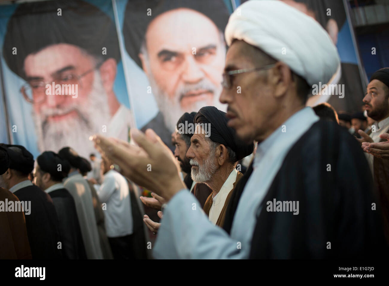 Tehran, Iran. 3rd June, 2014. Clerics pray as they stand in front of ...