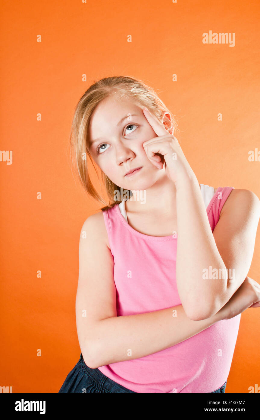 A young child deep in thought Stock Photo - Alamy