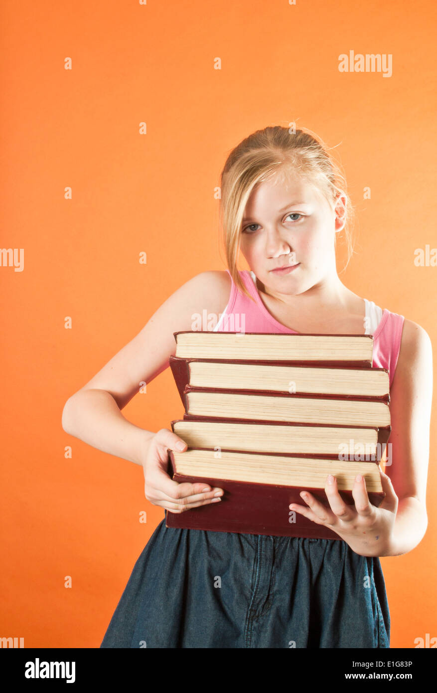 Girl carrying school books hi-res stock photography and images - Alamy