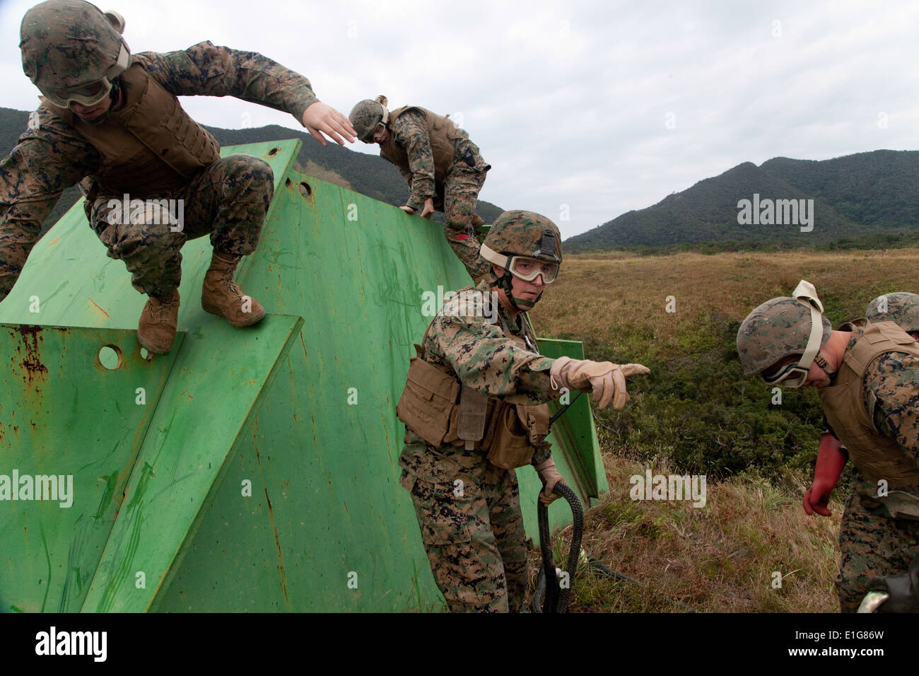U.S. Marine Corps Staff Sgt. Matthew Nissel, second from right, platoon ...