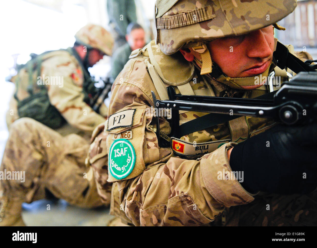 A Montenegrin soldier provides security as International Security ...