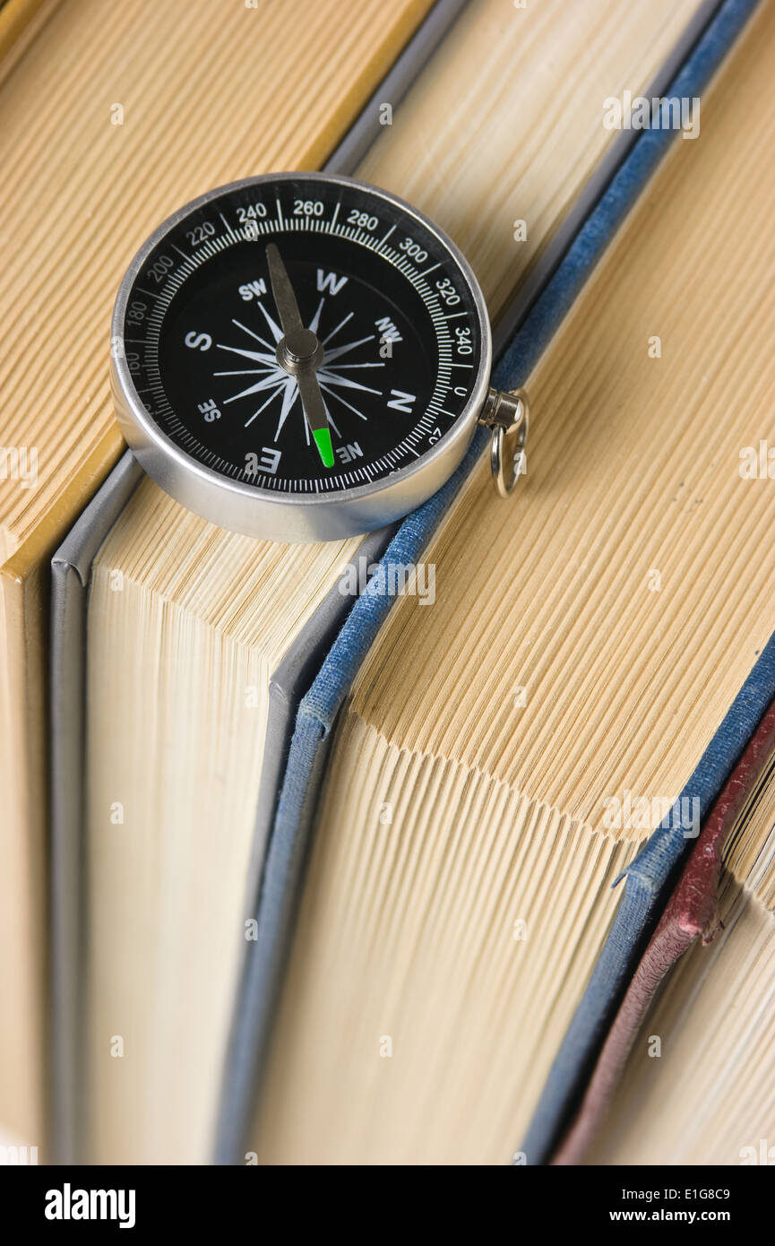 compass and the old books Stock Photo - Alamy