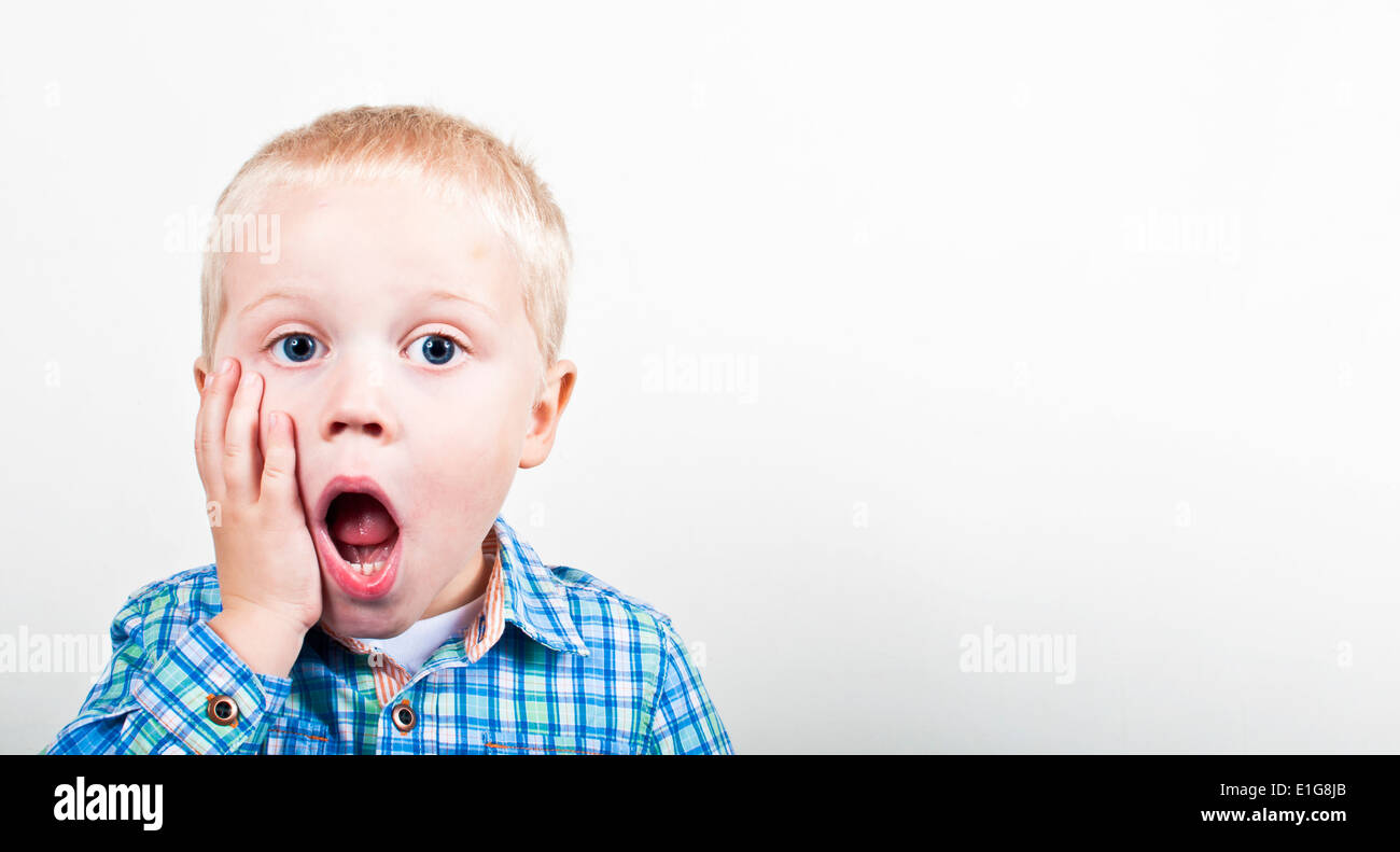 Small scared child with a look of fear Stock Photo - Alamy