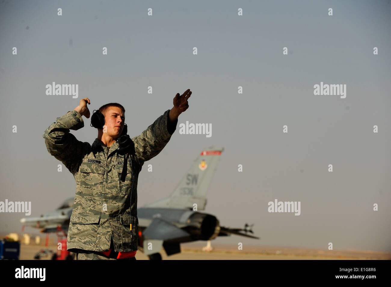 U.S. Air Force Airman 1st Class Zach Goodwin marshals an aircraft ...