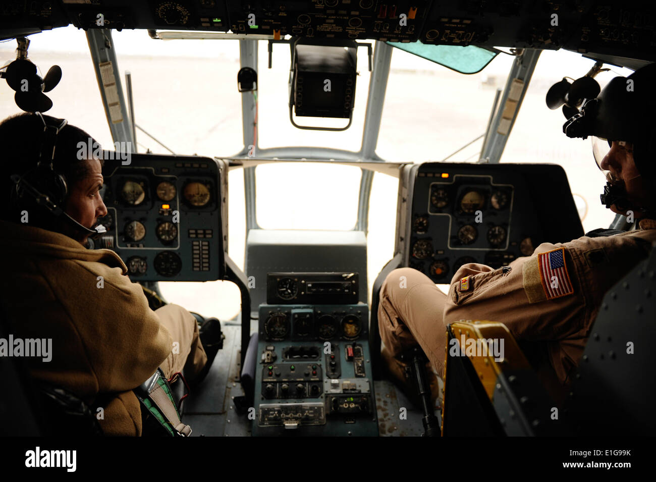Afghan National Army Air Force Capt. Hamid, left, listens to ...