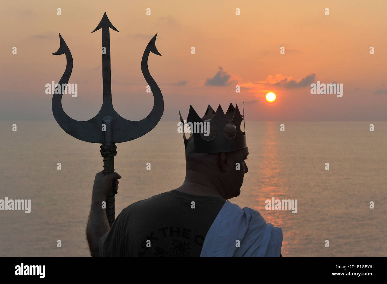 A U.S. Sailor dressed as Poseidon, the Greed god of the sea, aboard ...