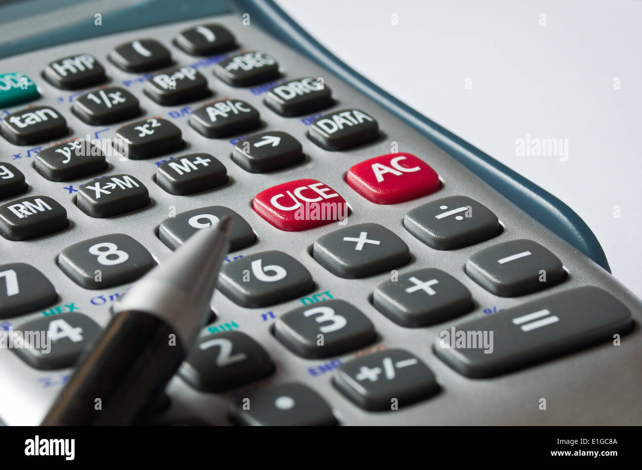 A calculator with pen Stock Photo - Alamy