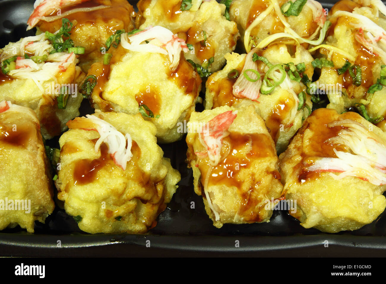 Japanese Dumplings in black plate Stock Photo - Alamy