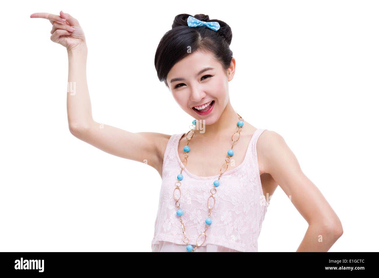 Cute young woman pointing Stock Photo - Alamy