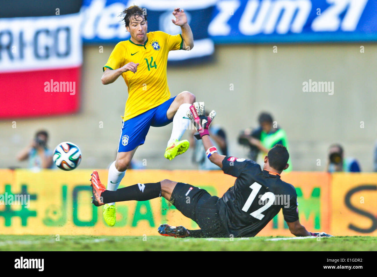Goiania, Brazil. 3rd June, 2014. Brazil's Maxwell (Top) vies for the ...