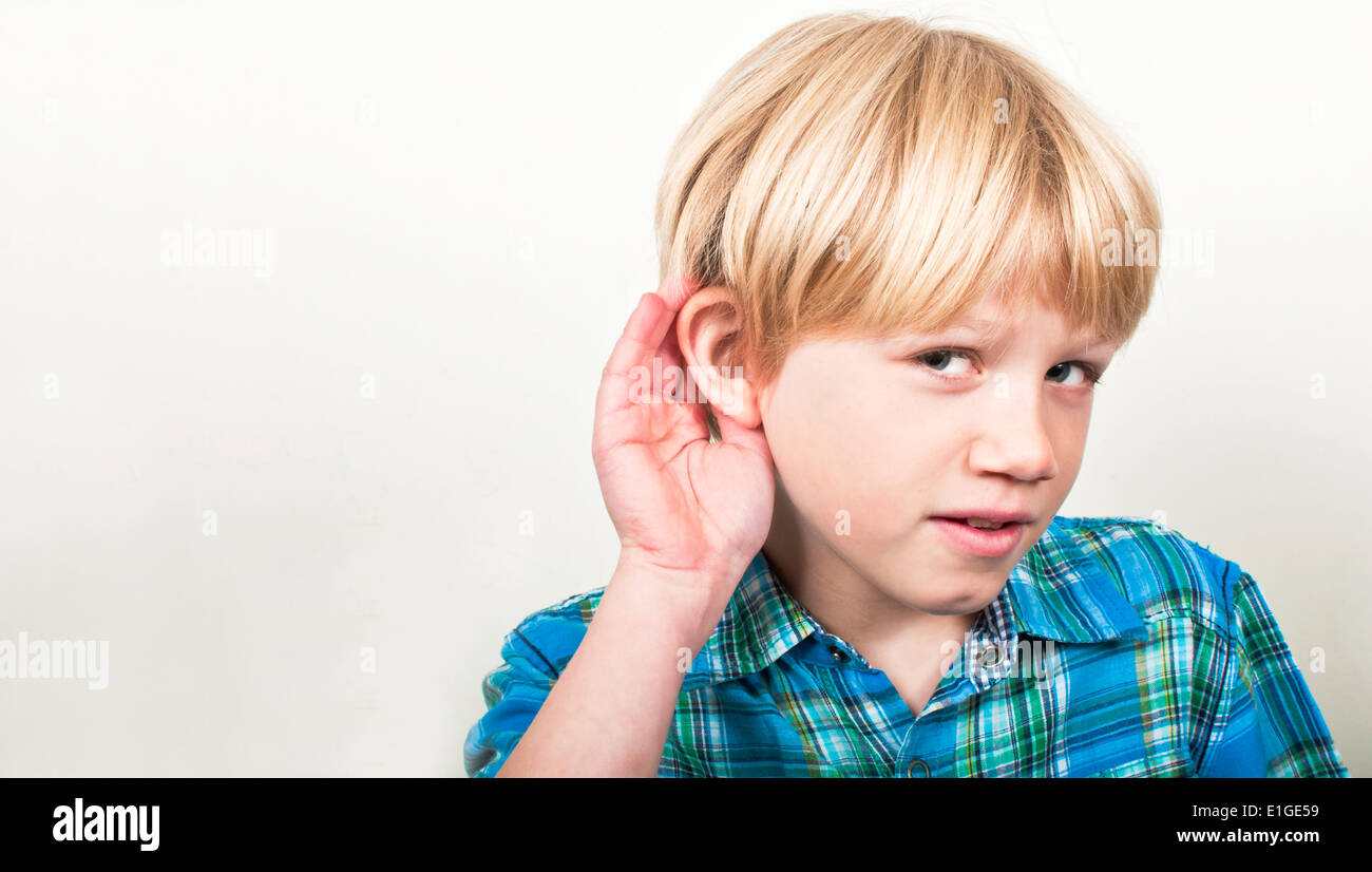 Child listening hand to ear hi-res stock photography and images - Alamy