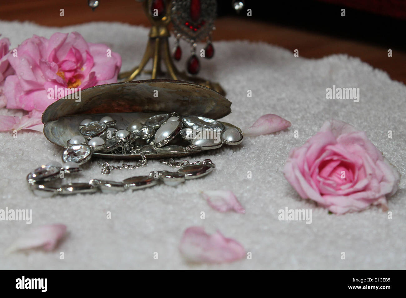 shell full wealth decoration with pink buds of roses Stock Photo - Alamy