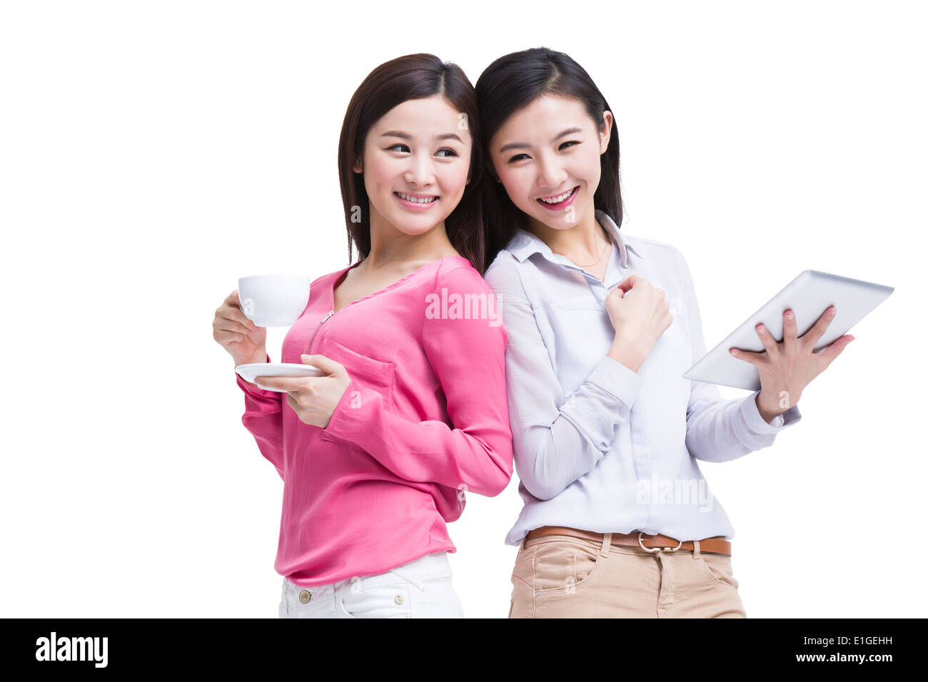 Best female friends back to back Stock Photo - Alamy
