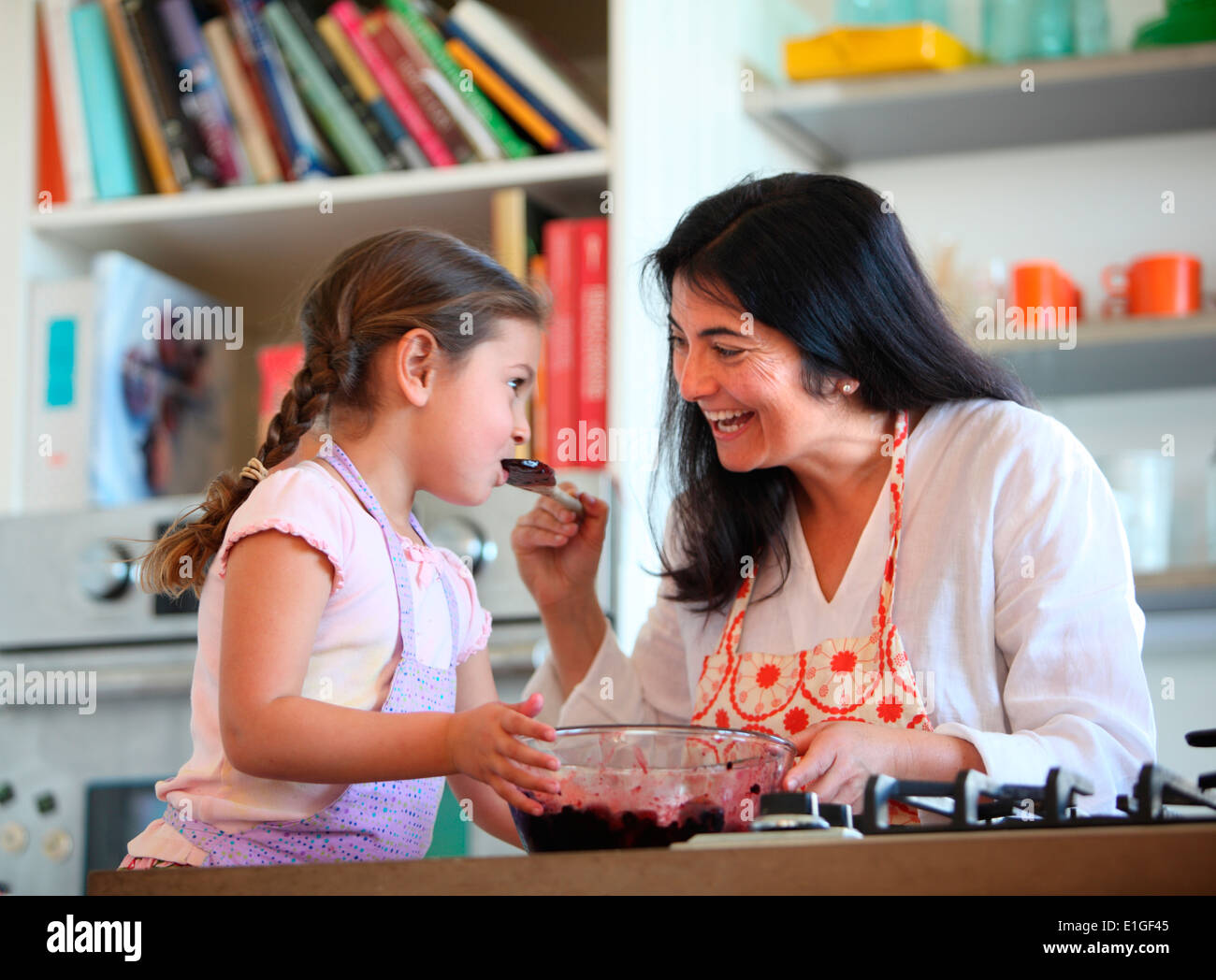Mother cooking with kids Stock Photo - Alamy