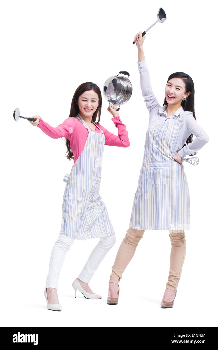 Humorous best female friends ready cooking Stock Photo - Alamy