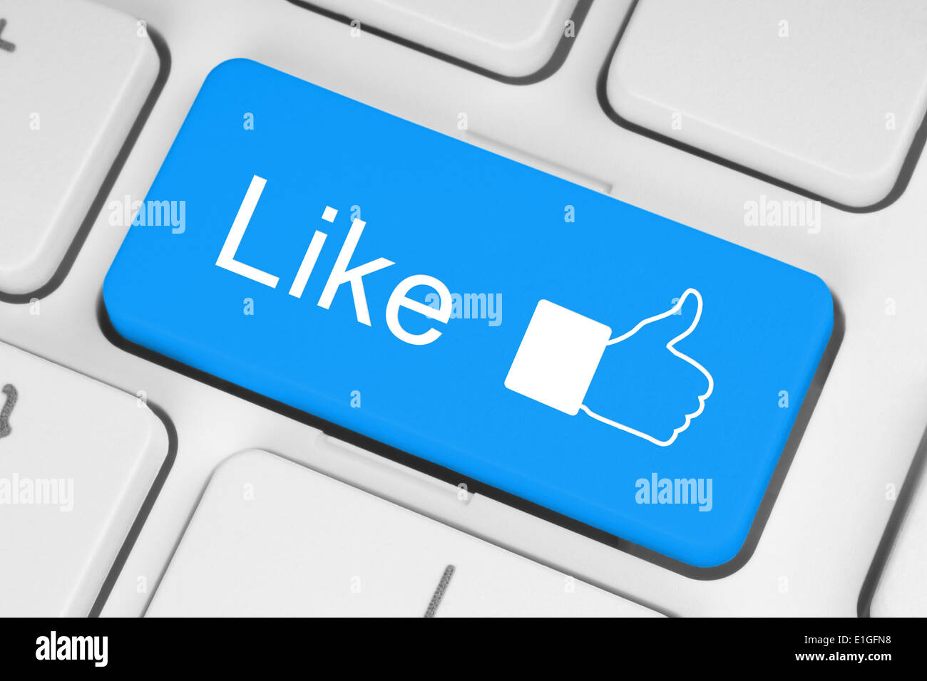Blue like button on keyboard Stock Photo - Alamy