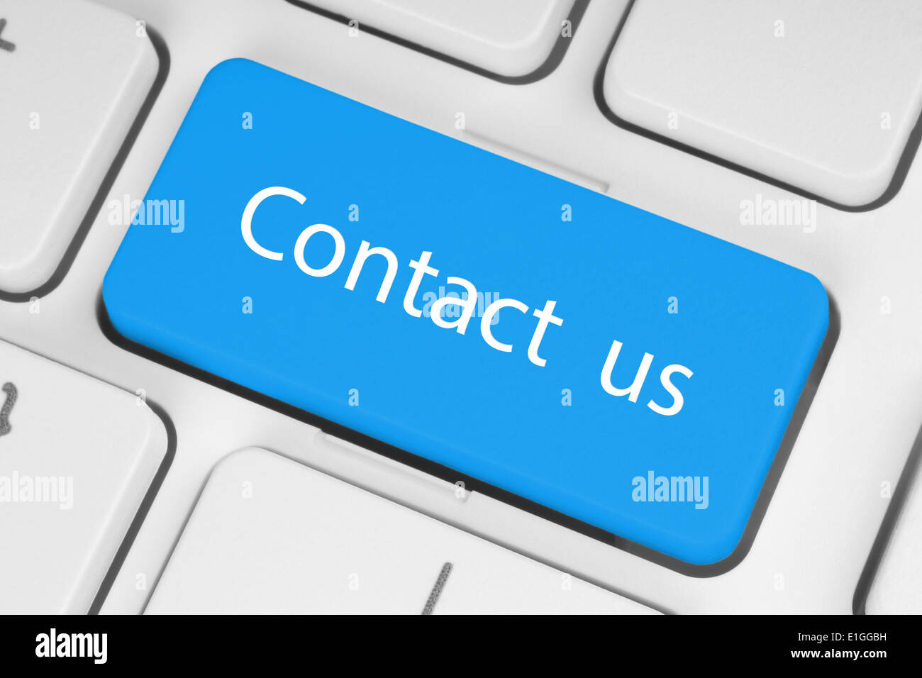 Big blue contact us keyboard button Stock Photo - Alamy