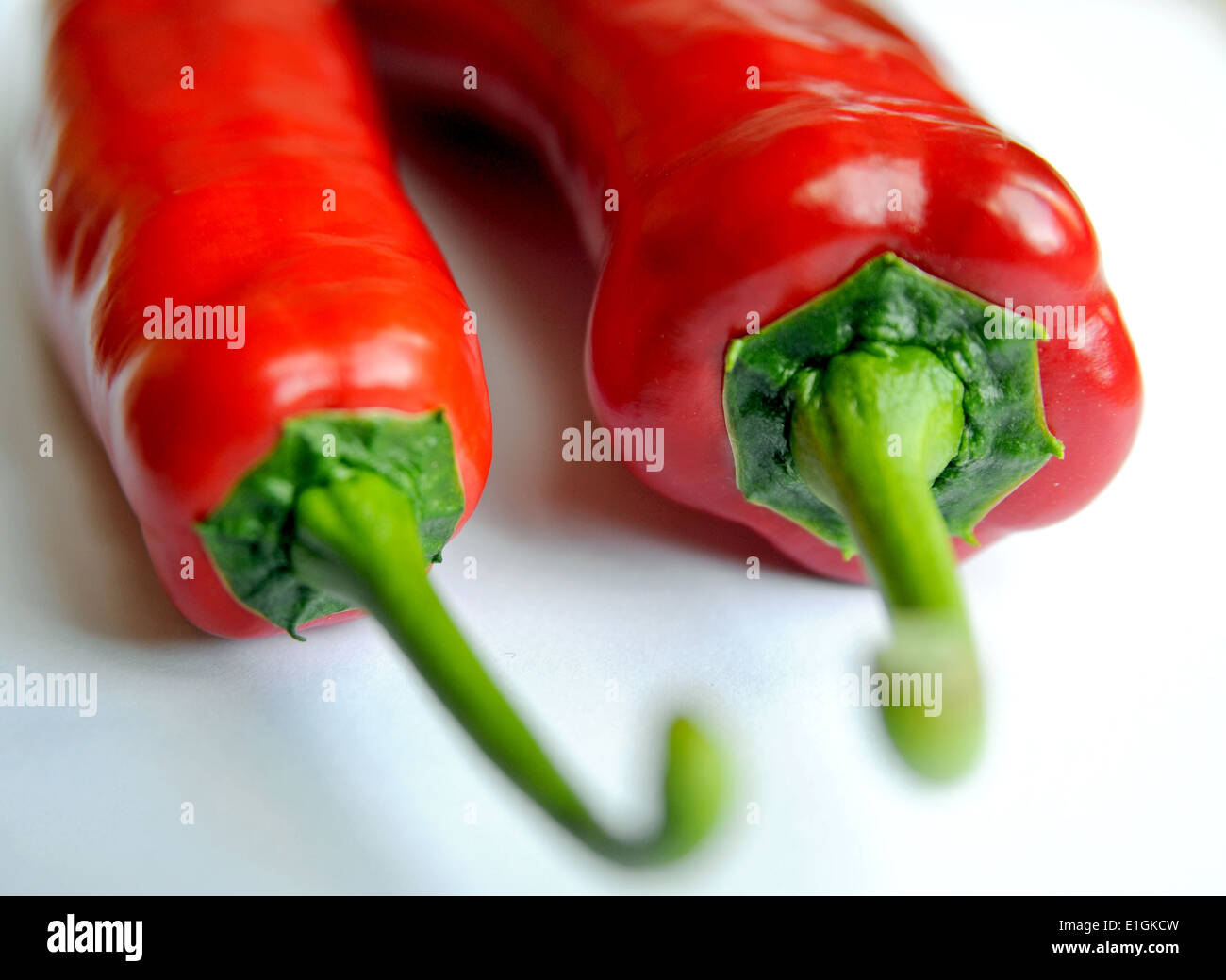 Pointed sweet red pepper peppers on white background Stock Photo - Alamy