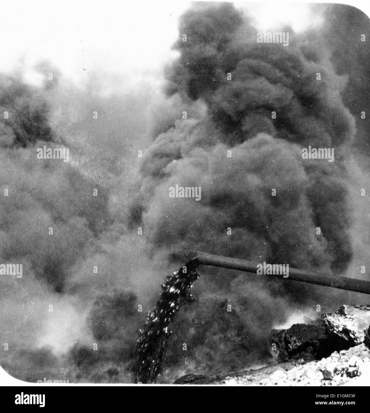 Photograph shows clouds of black smoke as a result of an oil well on ...