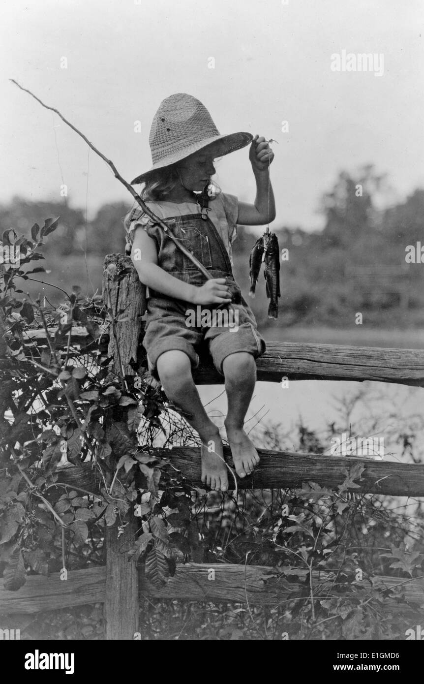 Child holding fishing pole Black and White Stock Photos & Images - Alamy