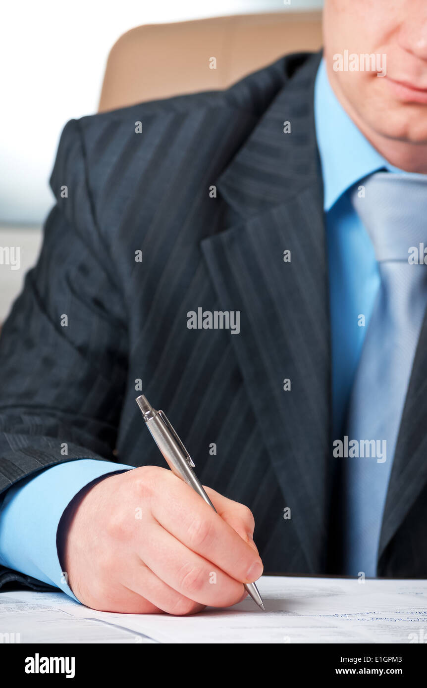 Closeup of businessman`s hand signing contract Stock Photo - Alamy