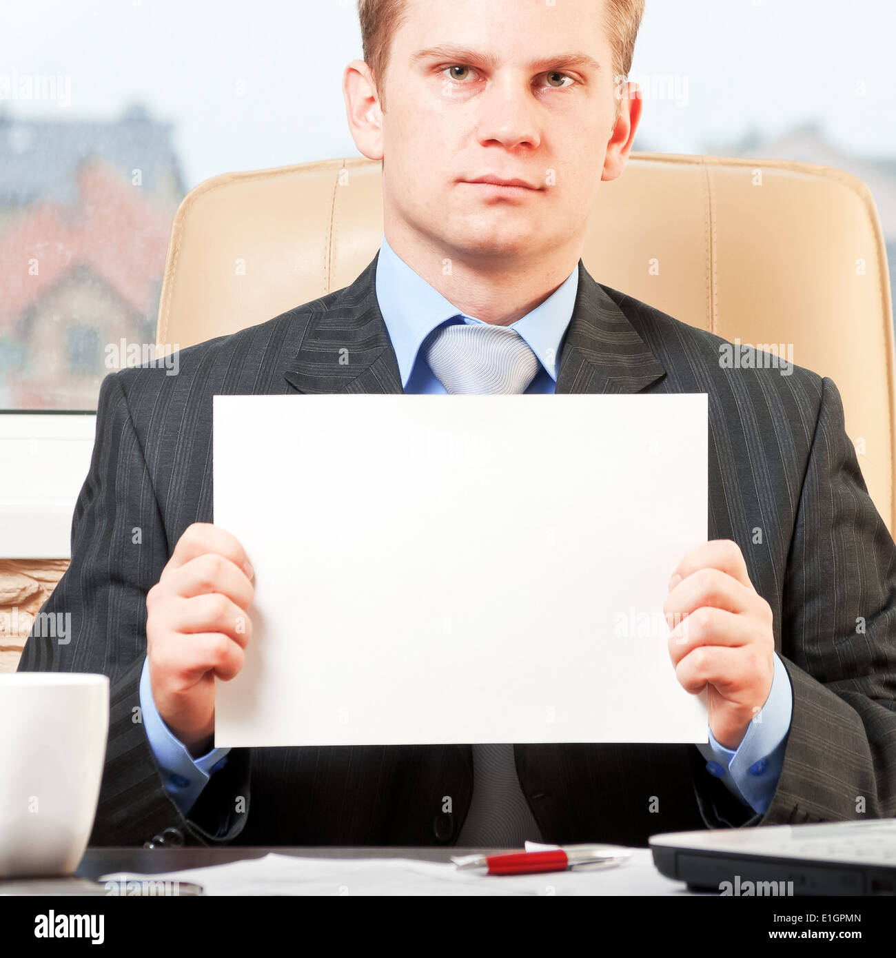 Man holding blank paper hi-res stock photography and images - Alamy