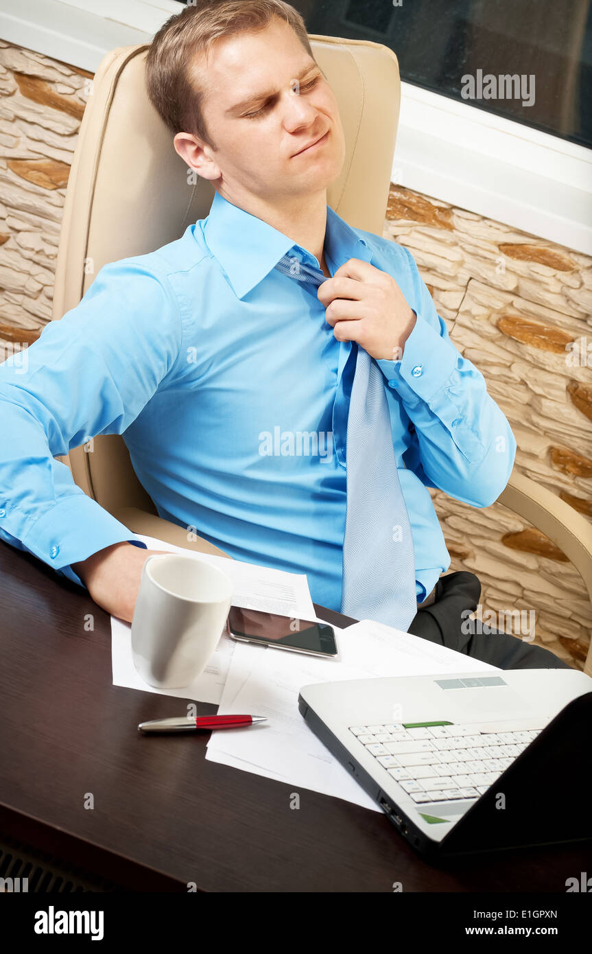 Young businessman with health problems Stock Photo - Alamy