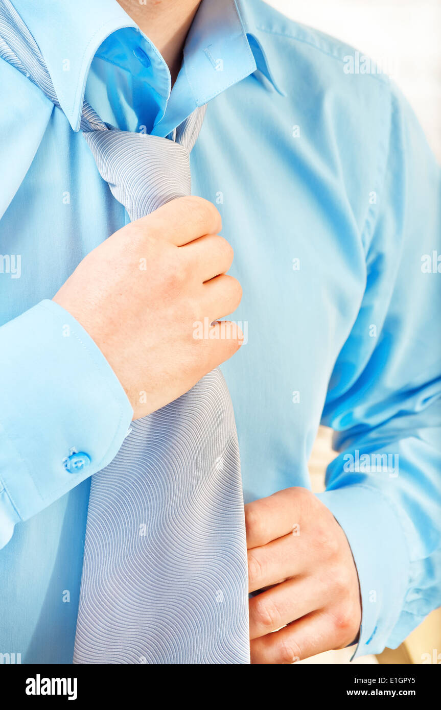 Tying a tie knot hi-res stock photography and images - Alamy