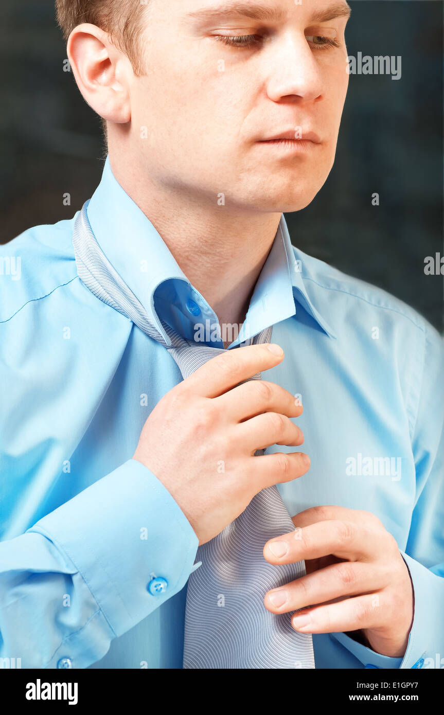 Tying a tie knot hi-res stock photography and images - Alamy