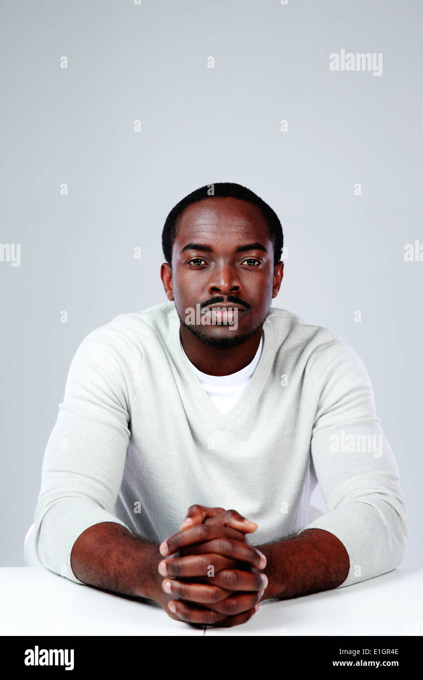 Pensive african man thinking sitting hi-res stock photography and ...