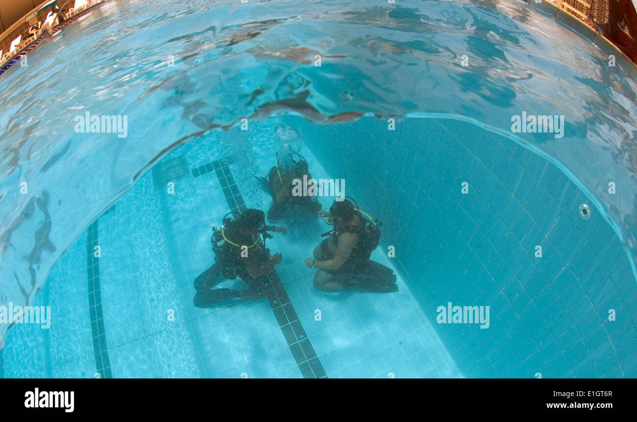 U.S. Navy Chief Navy Diver Aaron Knight, right, assigned to Commander ...