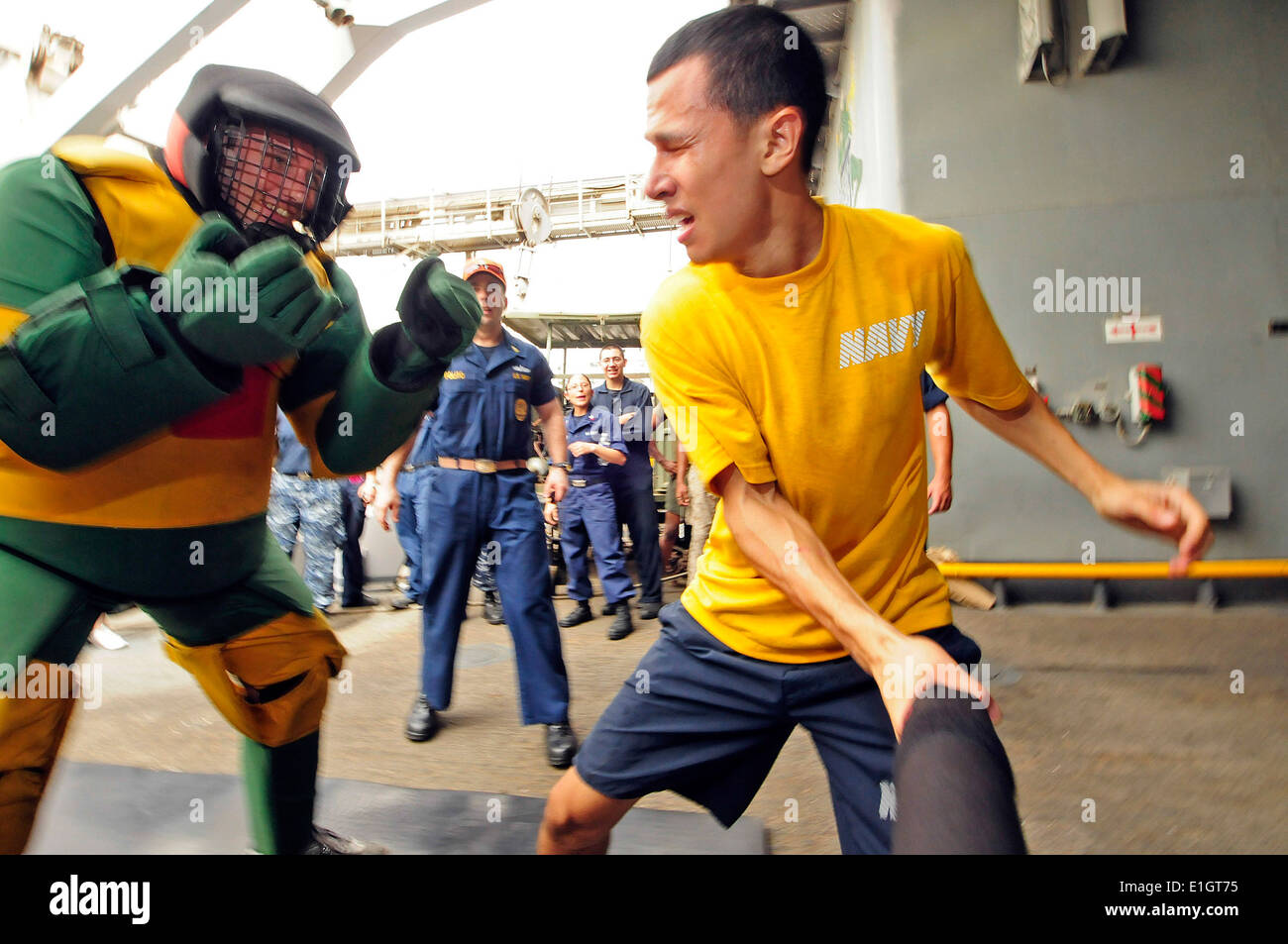 U.S. Navy Culinary Specialist Seaman Recruit Nicholas Suarez, right ...